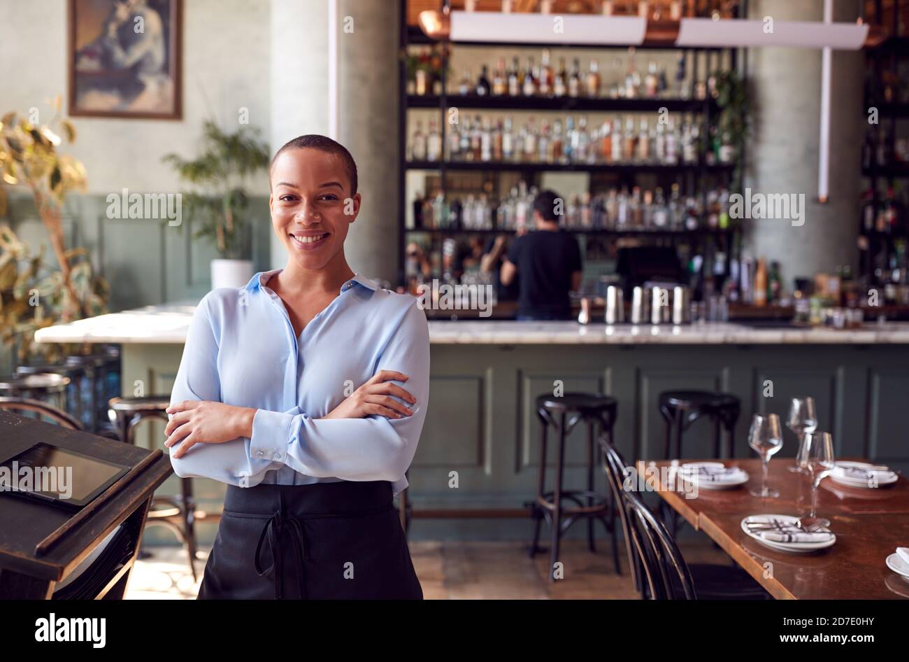 Portrait Of Confident Female Owner Of Restaurant Bar Standing By ...