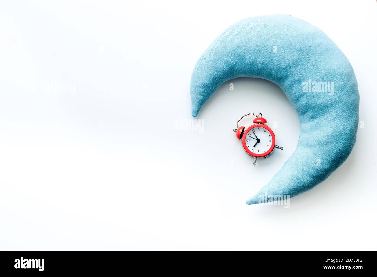 Sleeping pillow and alarm clock top view. Sleep disorder stress concept ...