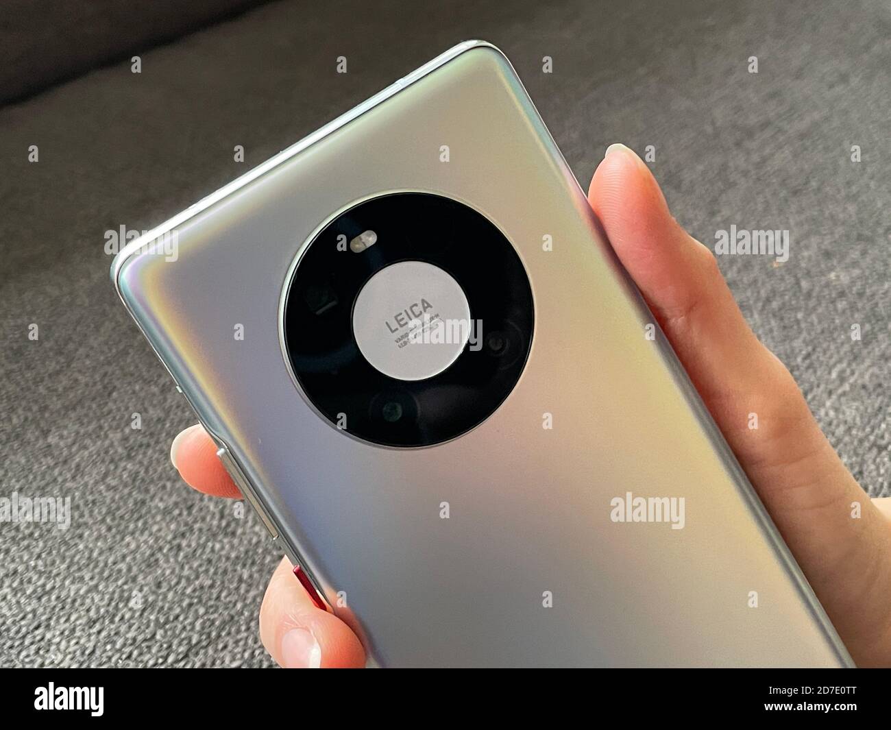 Berlin, Germany. 22nd Oct, 2020. A woman holds a Mate 40 Pro smartphone ...