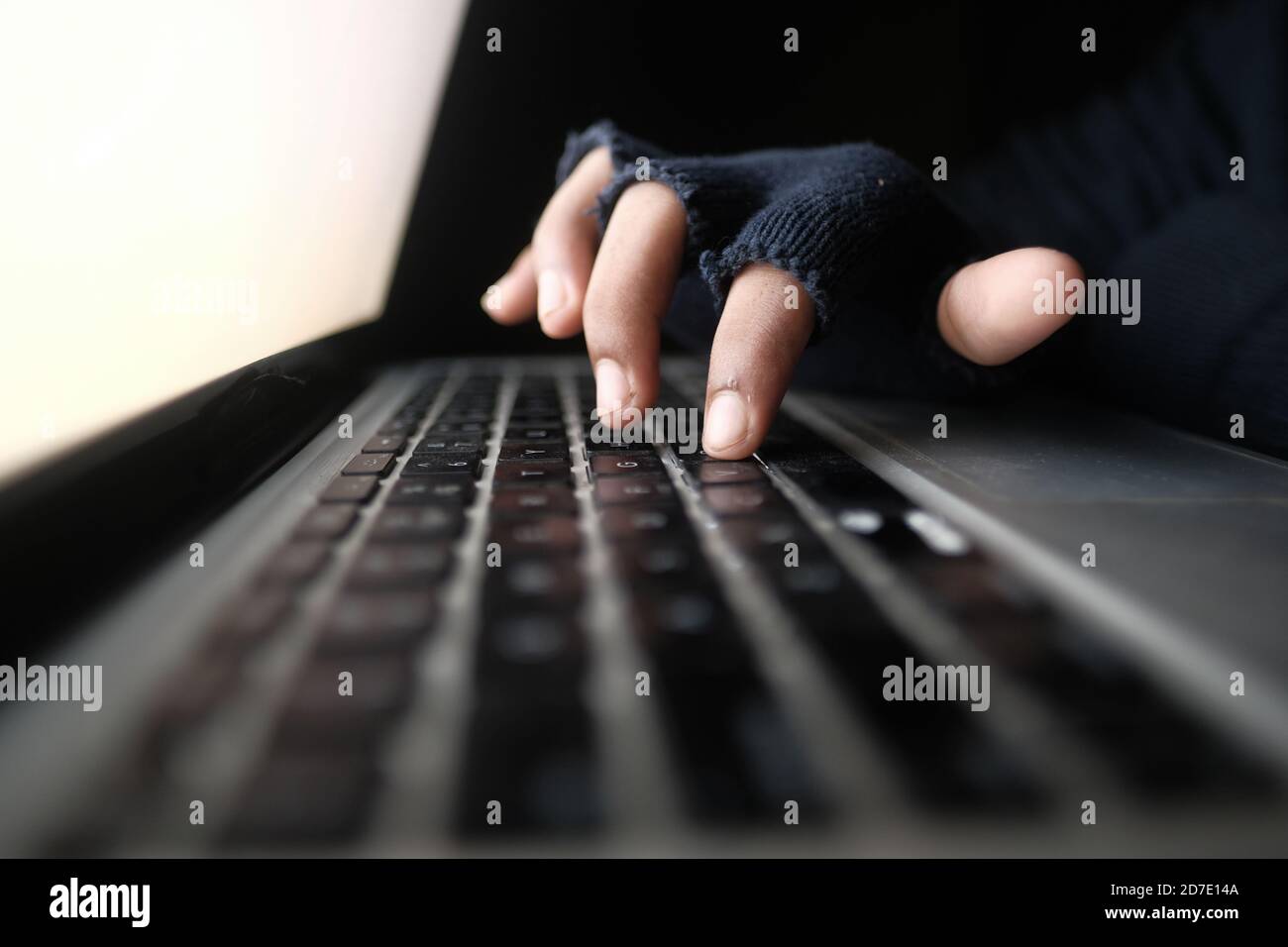 hacker hand stealing data from laptop top down Stock Photo - Alamy