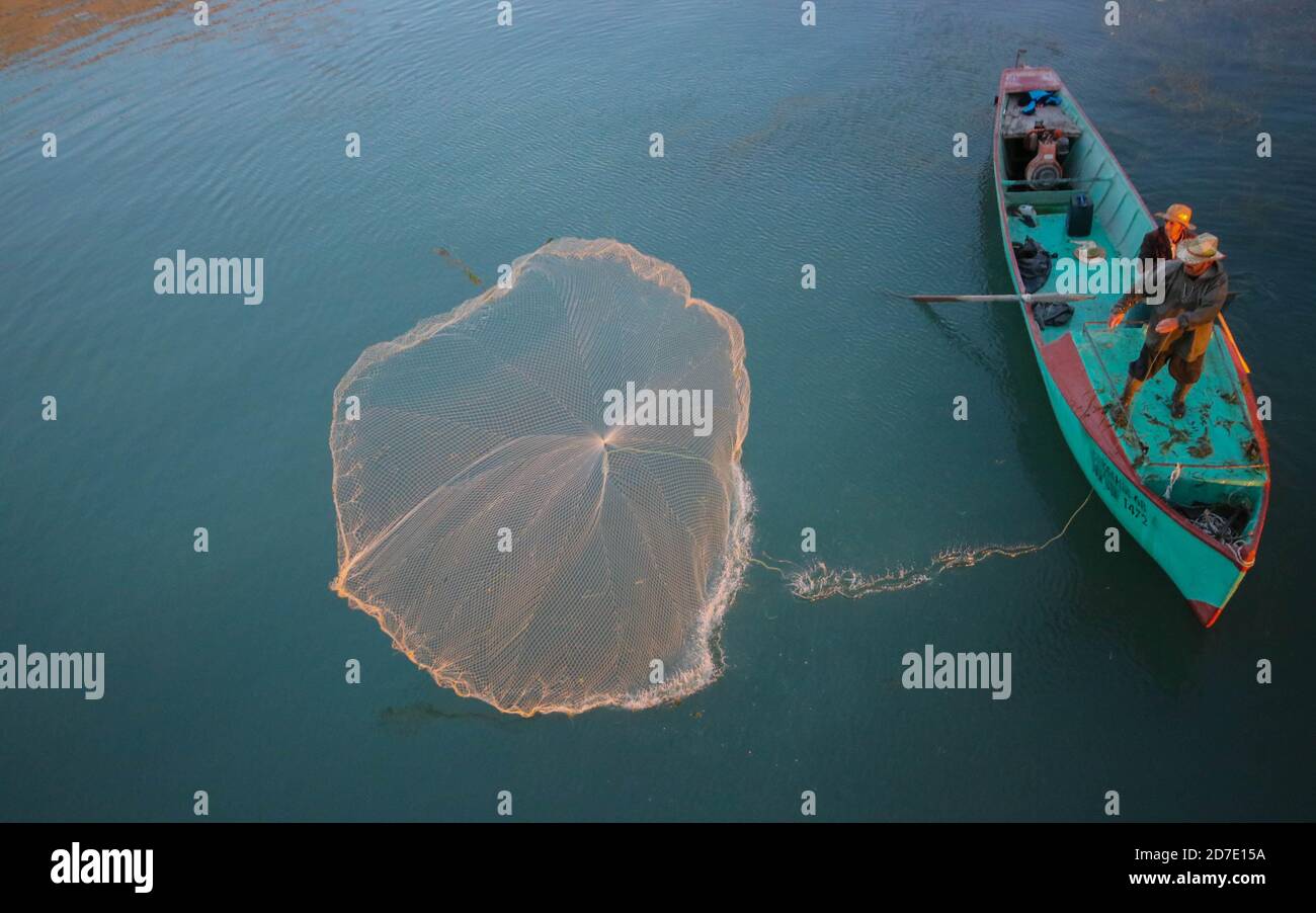 Fishing industry concept on Beysehir Lake, catching fish with nets ...