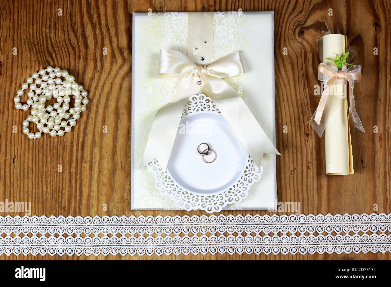 wedding ring invitation on wood background Stock Photo - Alamy
