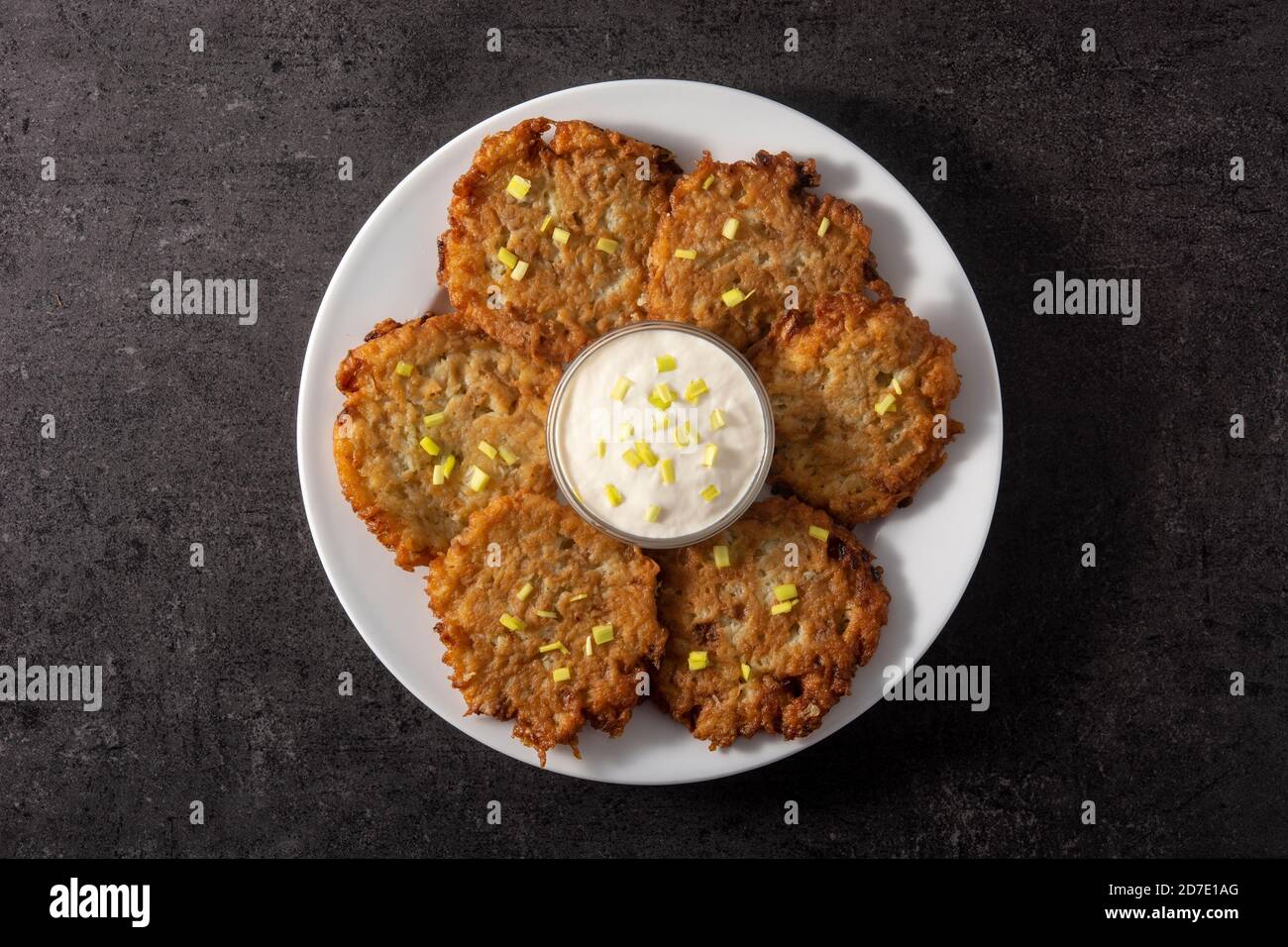 Traditional Jewish latkes or potato pancakes on black background Stock ...