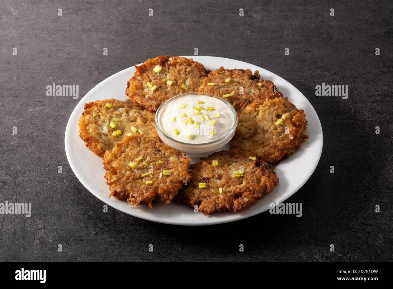 Traditional Jewish latkes or potato pancakes on black background Stock ...