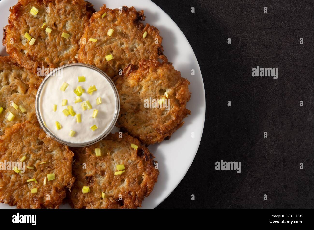 Traditional Jewish latkes or potato pancakes on black background Stock ...