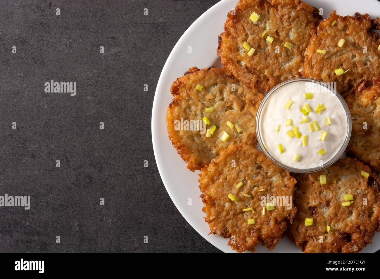Traditional Jewish latkes or potato pancakes on black background Stock ...