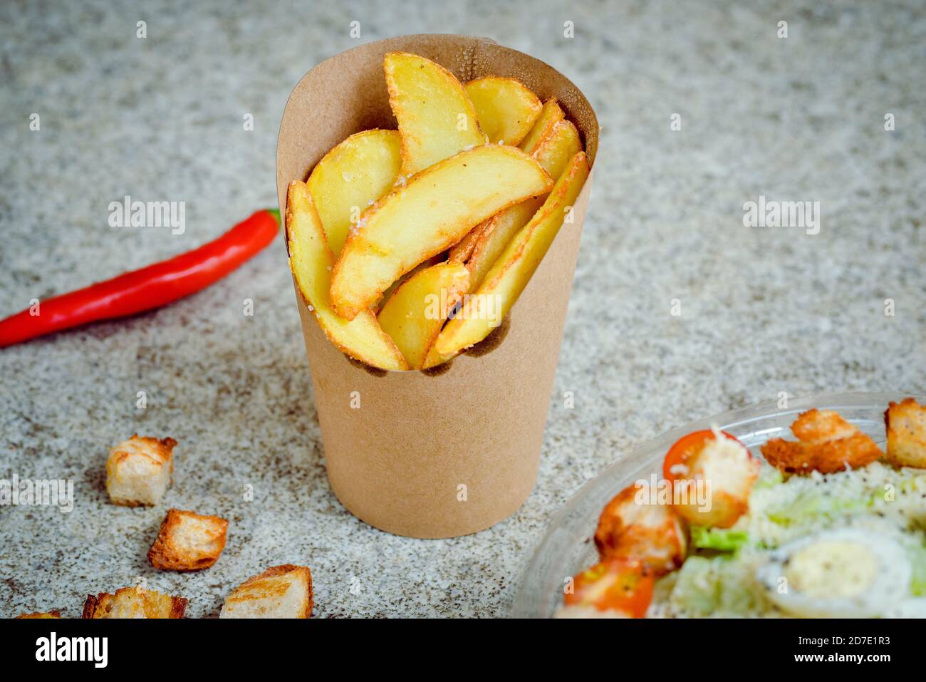 Fries in a cardboard packaging Stock Photo - Alamy