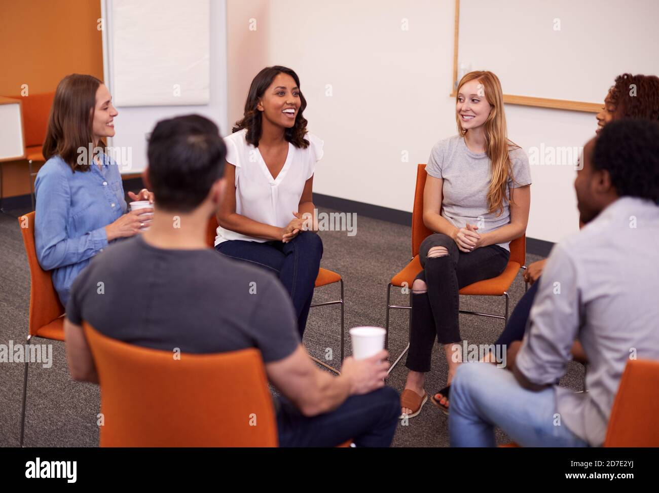 Multi-Cultural Group Of Men And Women At Mental Health Group Therapy ...