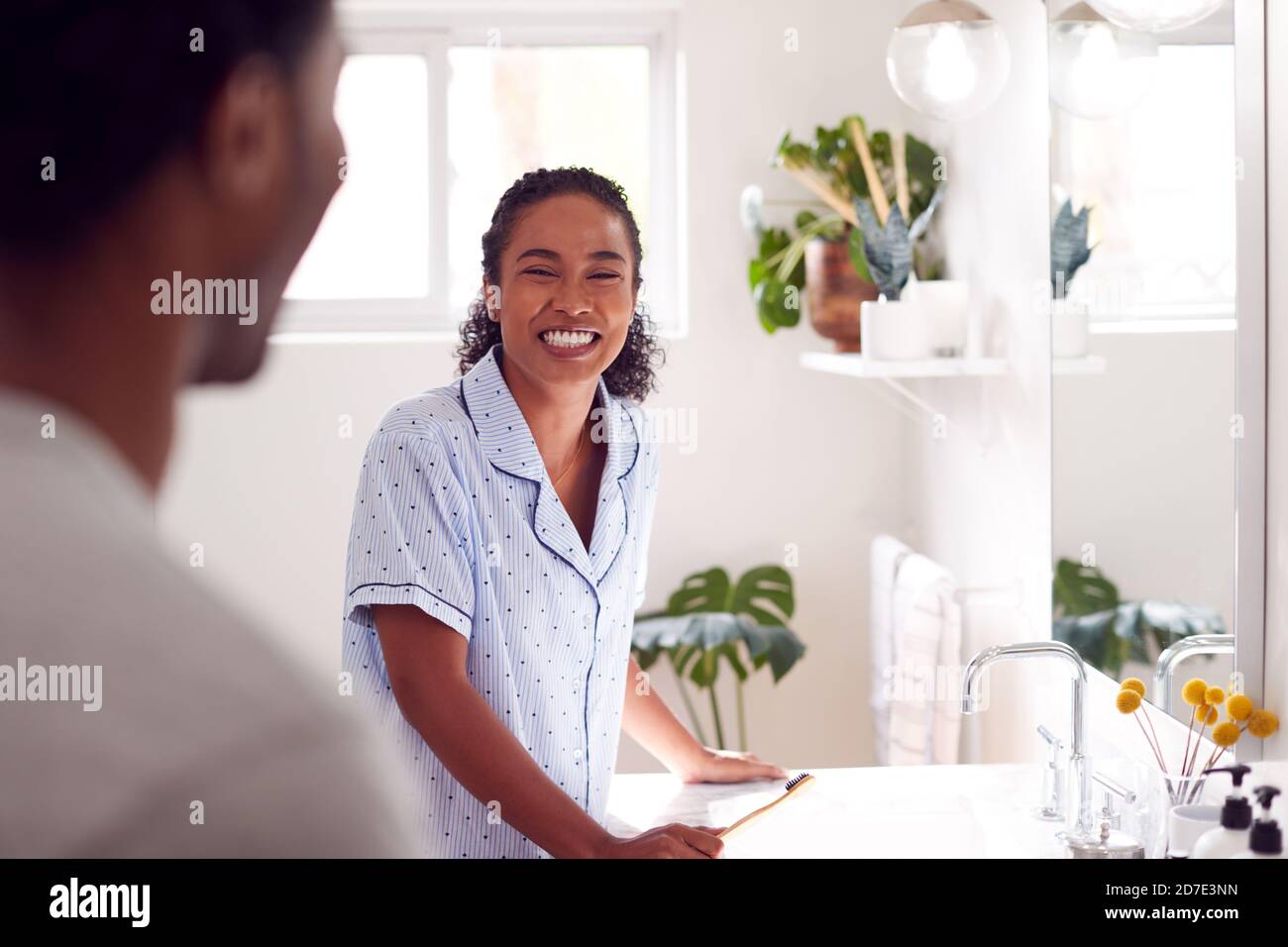 Couple Wearing Pyjamas Standing In Bathroom At Sink Brushing Teeth In ...