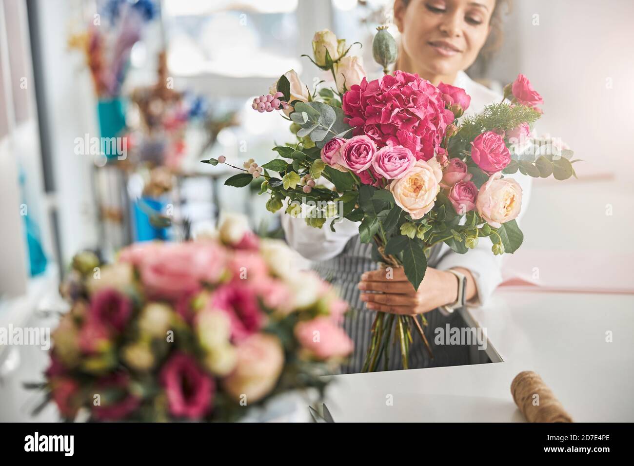 Professional florist posing with a gorgeous floral composition Stock ...