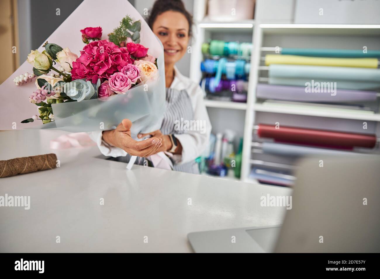 Female shop assistant wrapping hi-res stock photography and images - Alamy