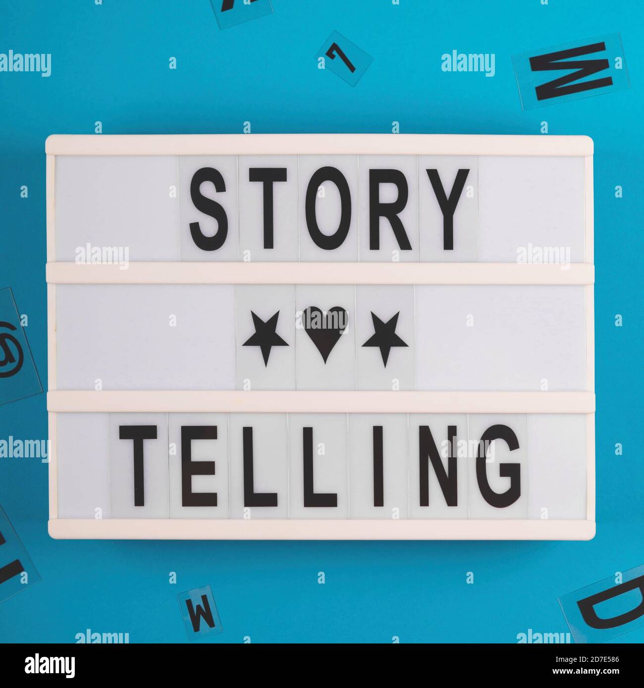 Tell stories to sell. Storytelling concept layout on blue Stock Photo ...