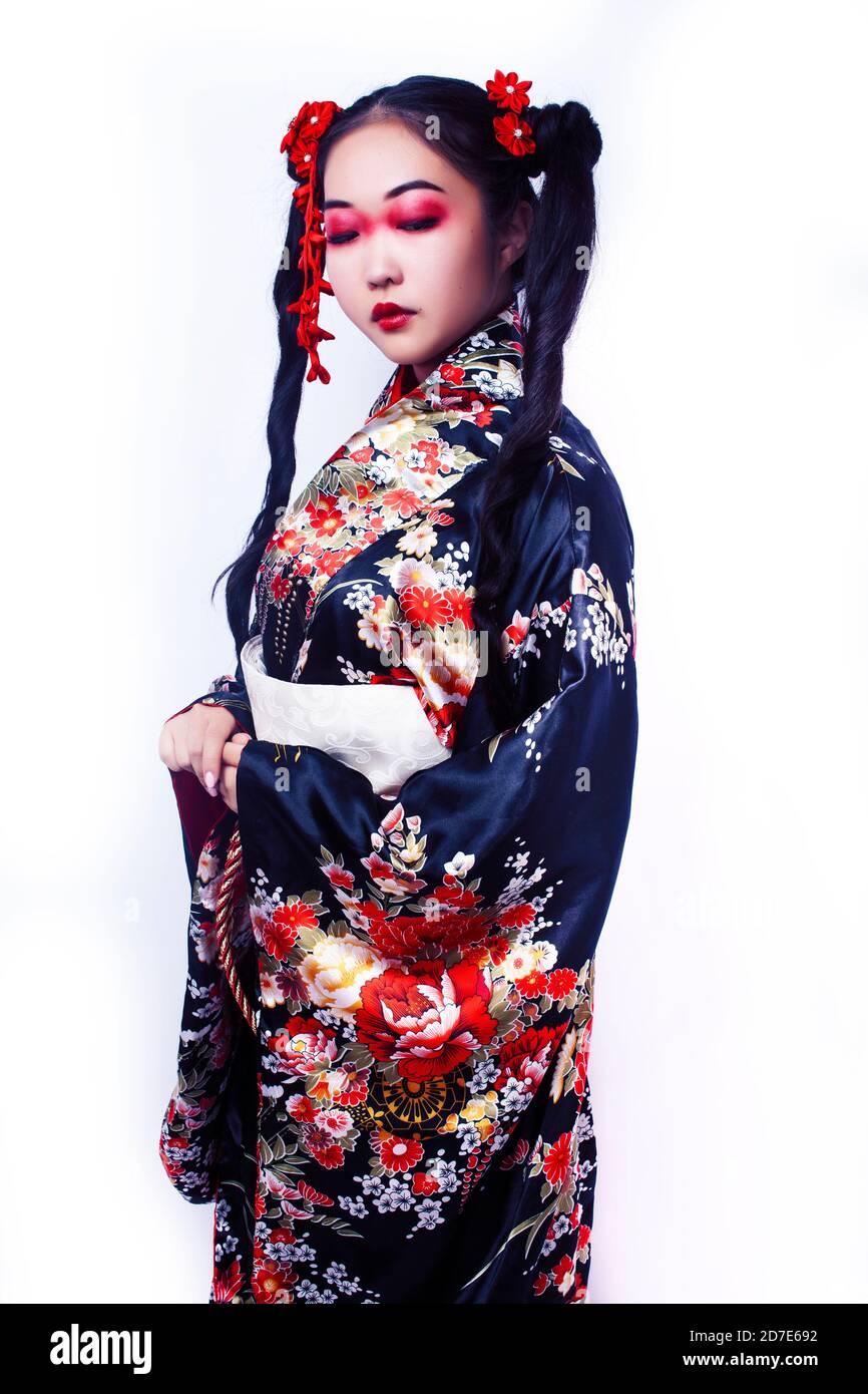 young pretty geisha in black kimono with sakura, asian ethno closeup on ...