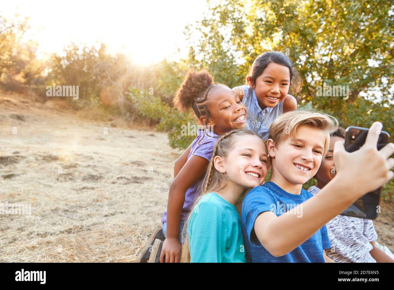 Group Of Multi-Cultural Children Posing For Selfie With Friends In ...