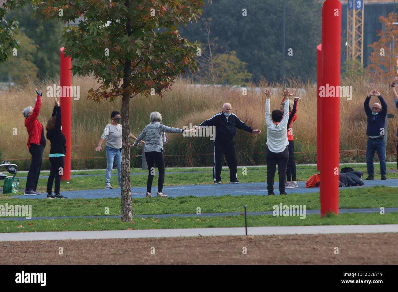 Fitness class in a public park, Milan, Italy Stock Photo - Alamy