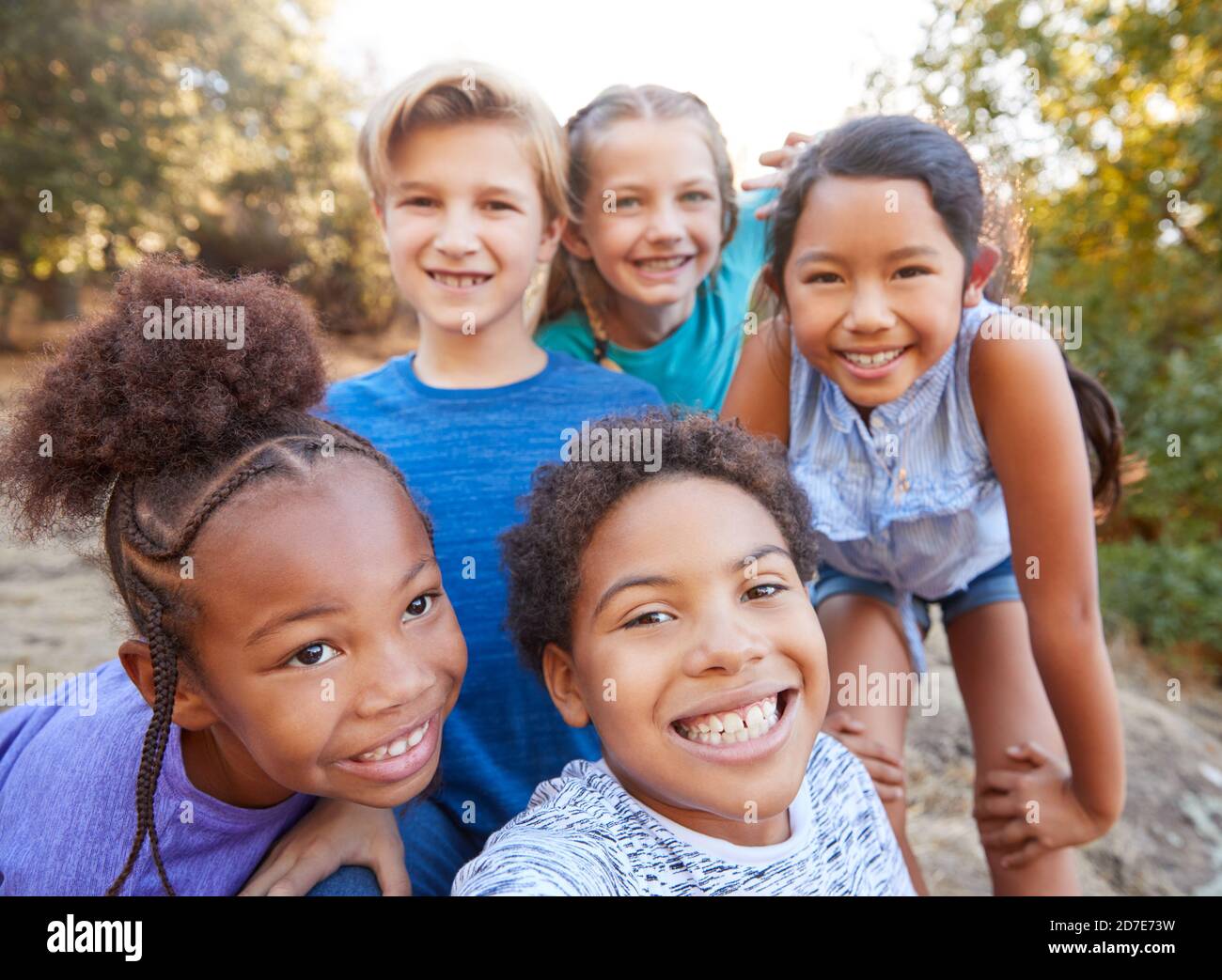 Portrait Of Multi-Cultural Children Hanging Out With Friends In ...