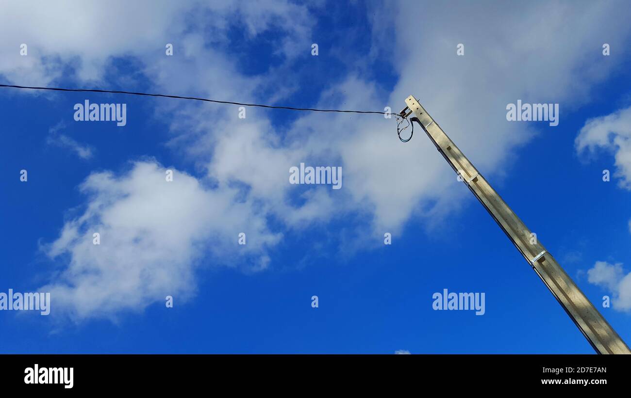 Power pole and blue sky Stock Photo - Alamy