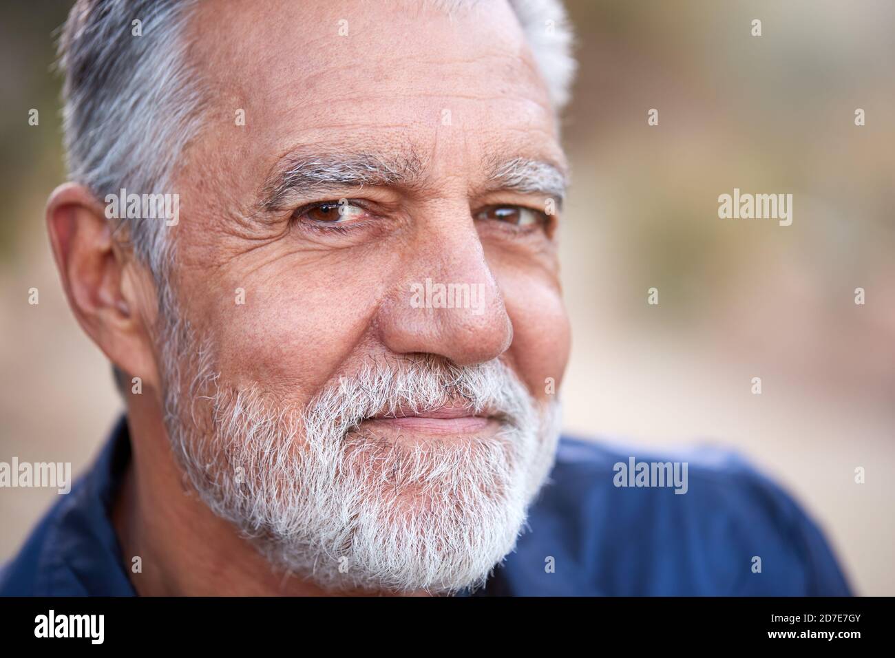 Outdoor Portrait Of Serious Hispanic Senior Man With Mental Health ...