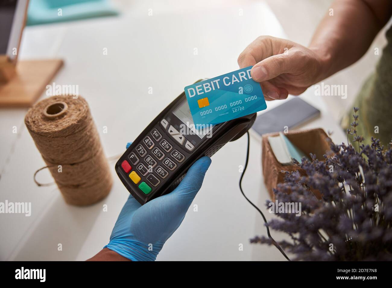 Man is paying with a debit card Stock Photo - Alamy
