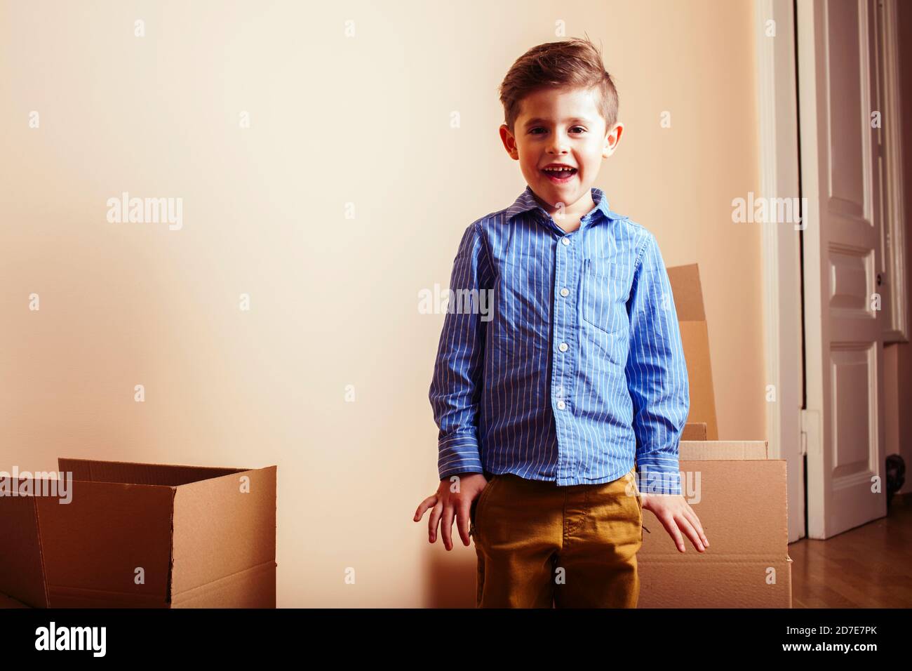little cute boy in empty room, move to new house. home alone among ...