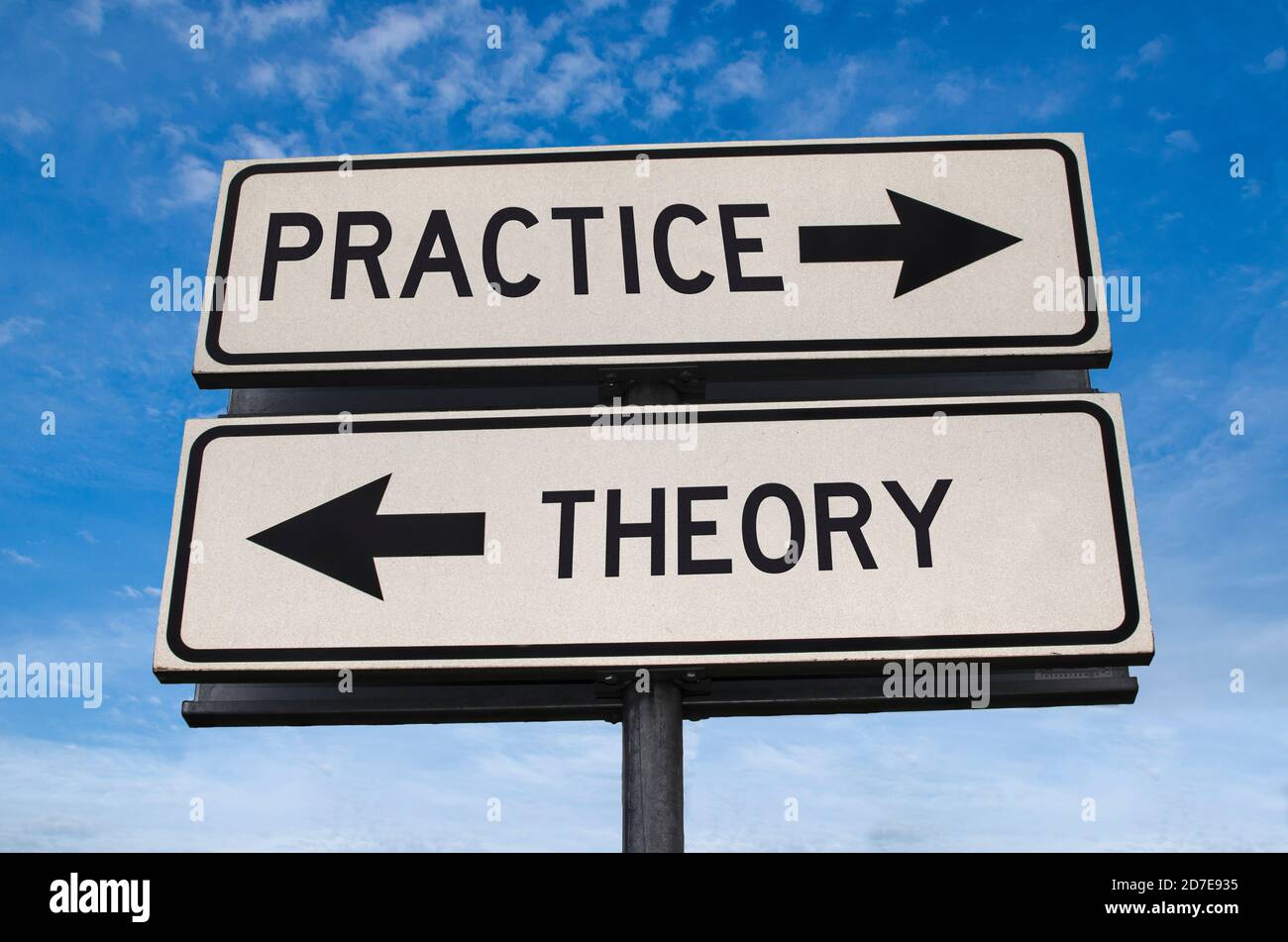 Practice vs theory. White two street signs with arrow on metal pole ...