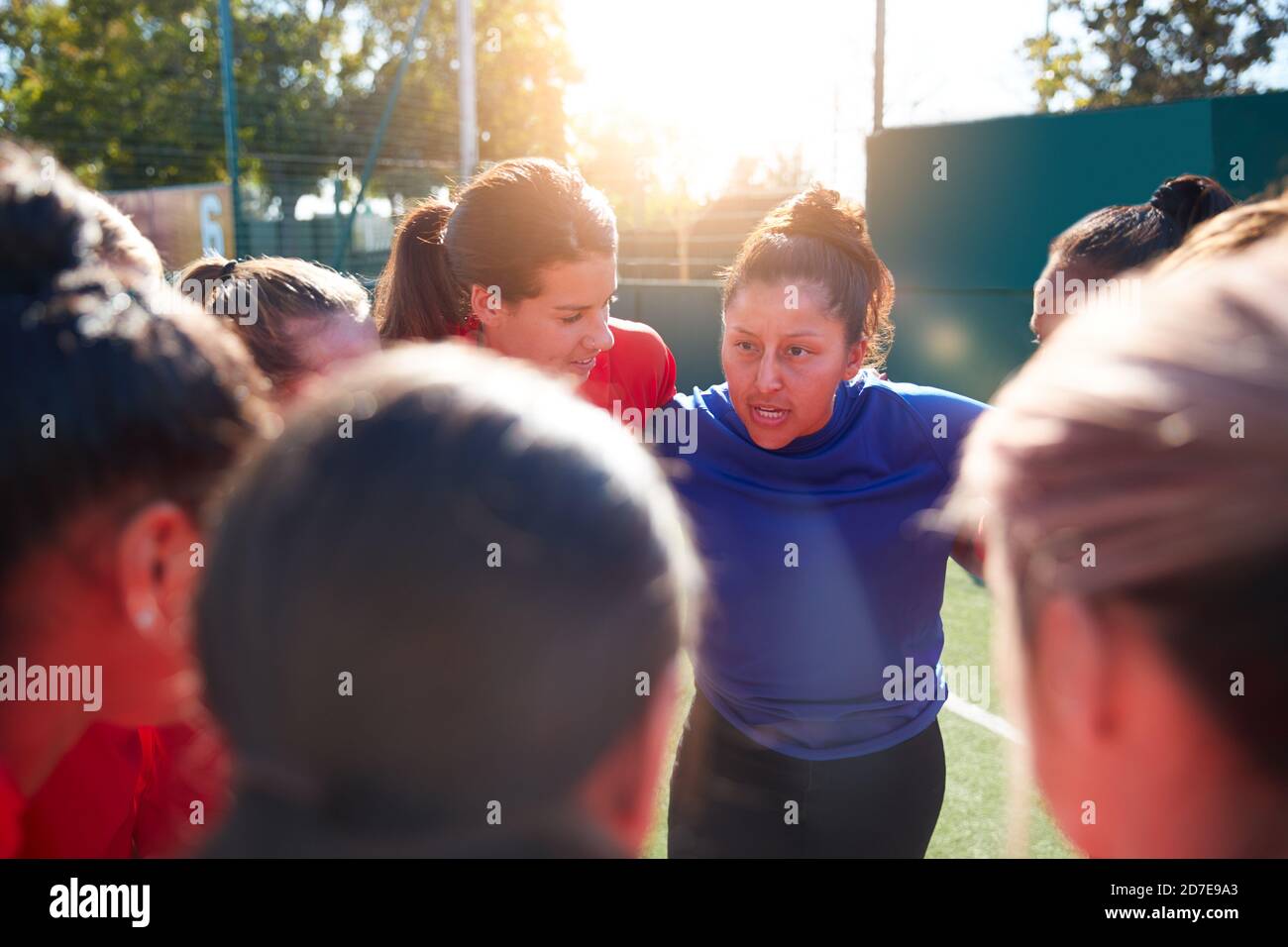 Manager In Huddle With Womens Football Team Giving Motivational Pep ...