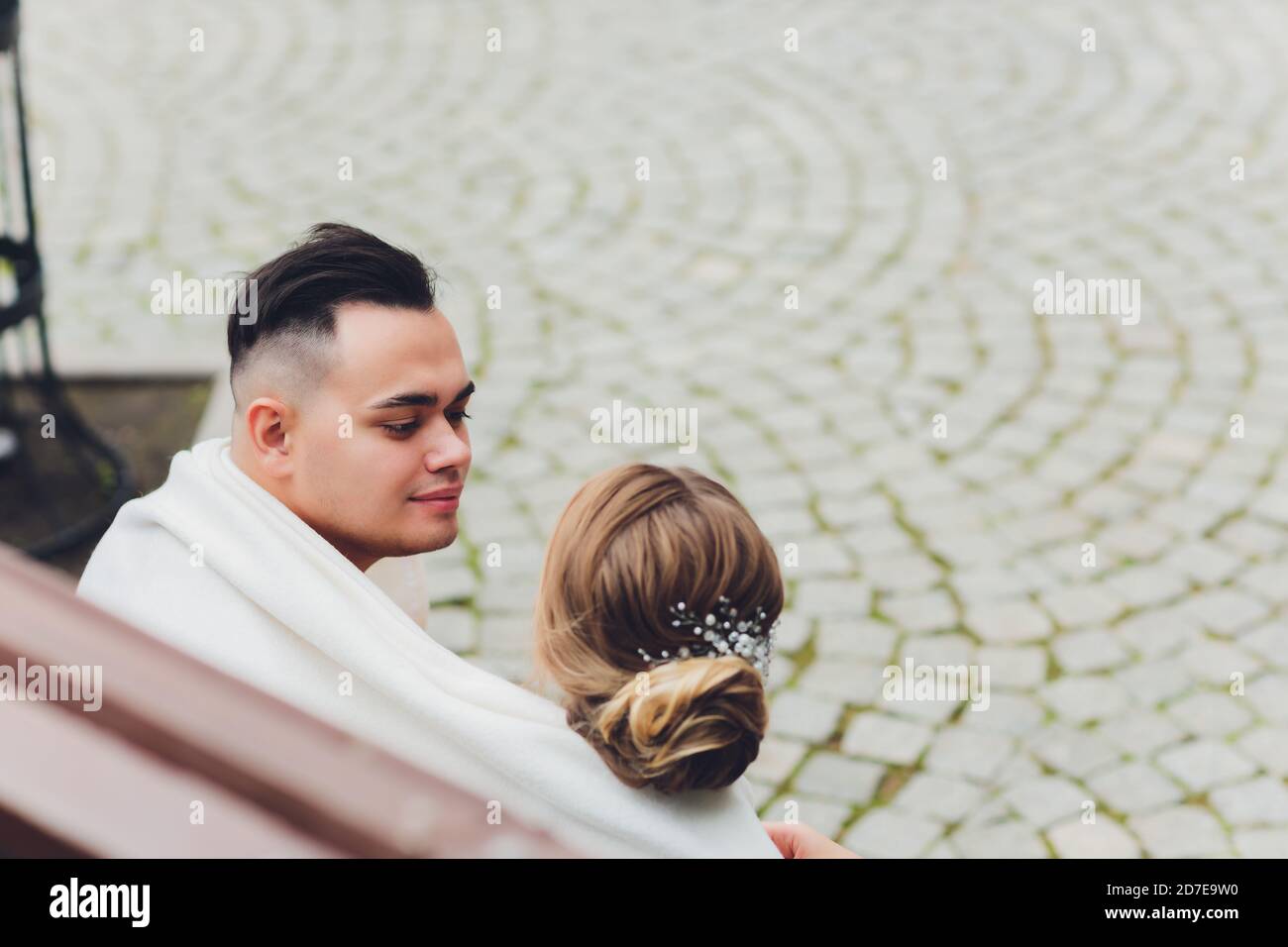 Young and trendy man and woman models walks on the street. in old town ...