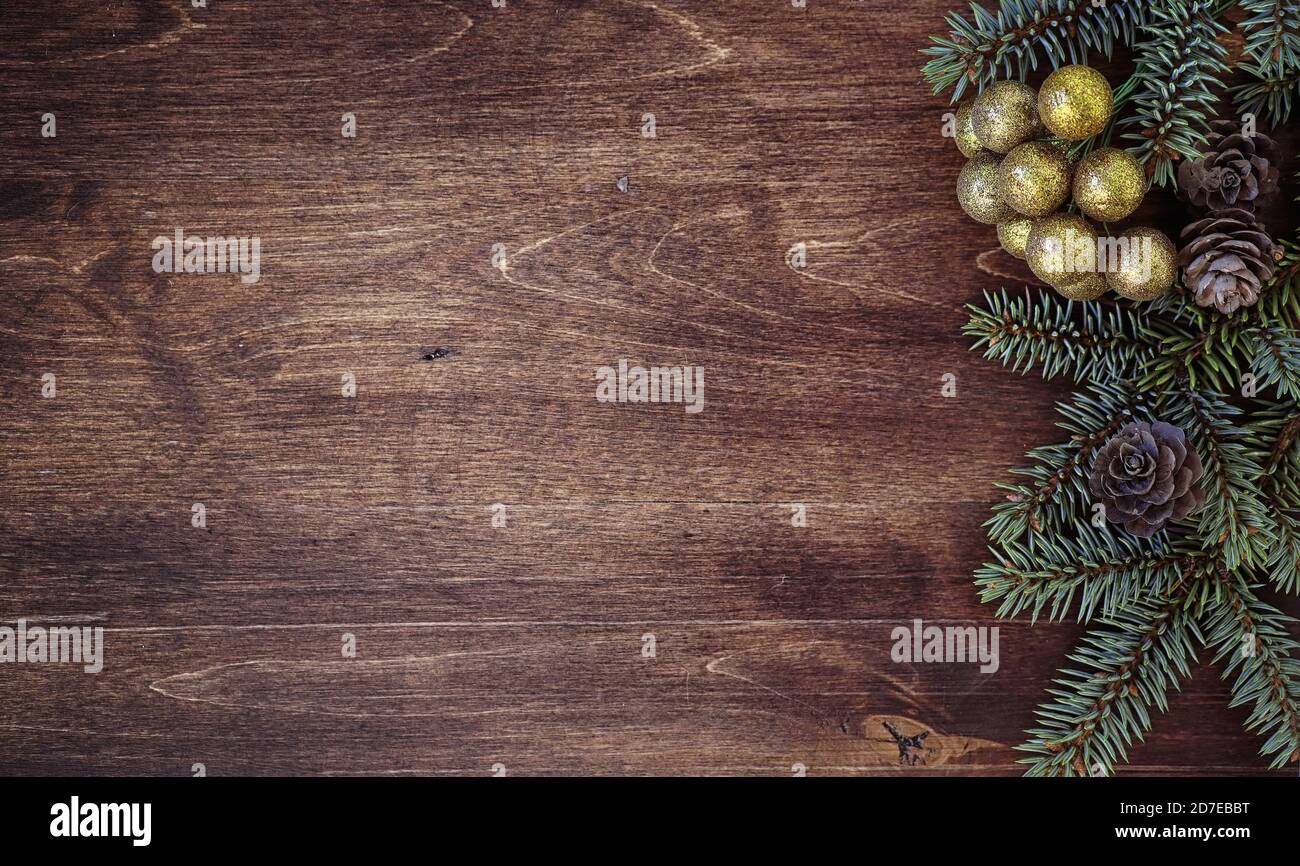 New Year's background. Spruce branches on a wooden table. Ornaments for ...