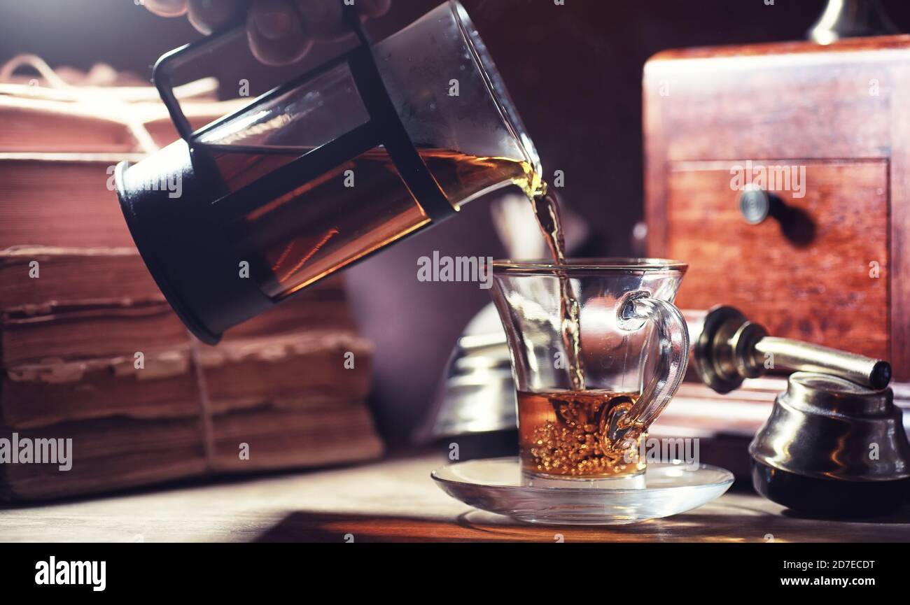 Brewing tea on a wooden table in the morning Stock Photo - Alamy