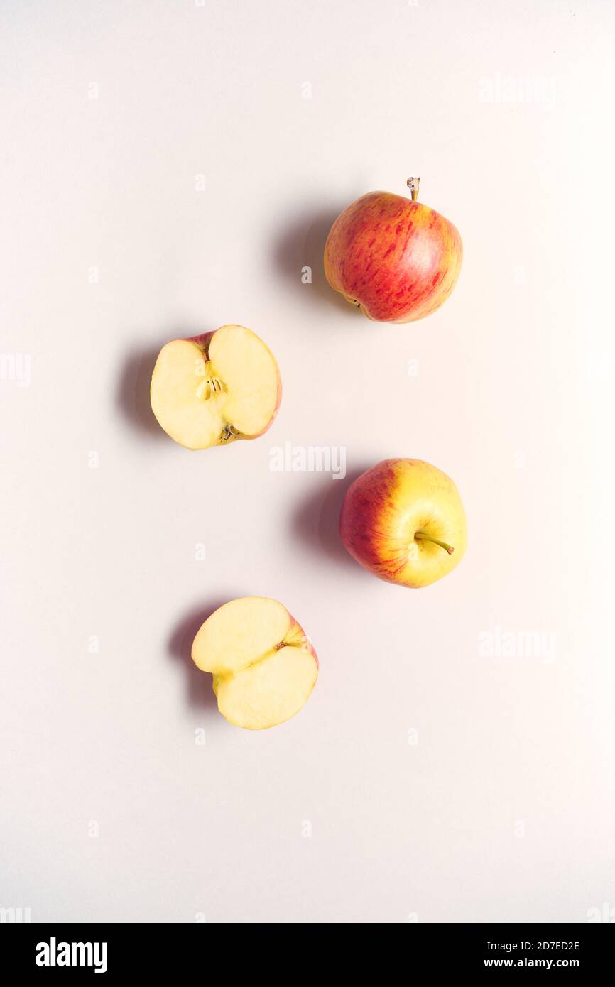 Overhead View Of Whole And Halved Fresh Apples On White Background ...