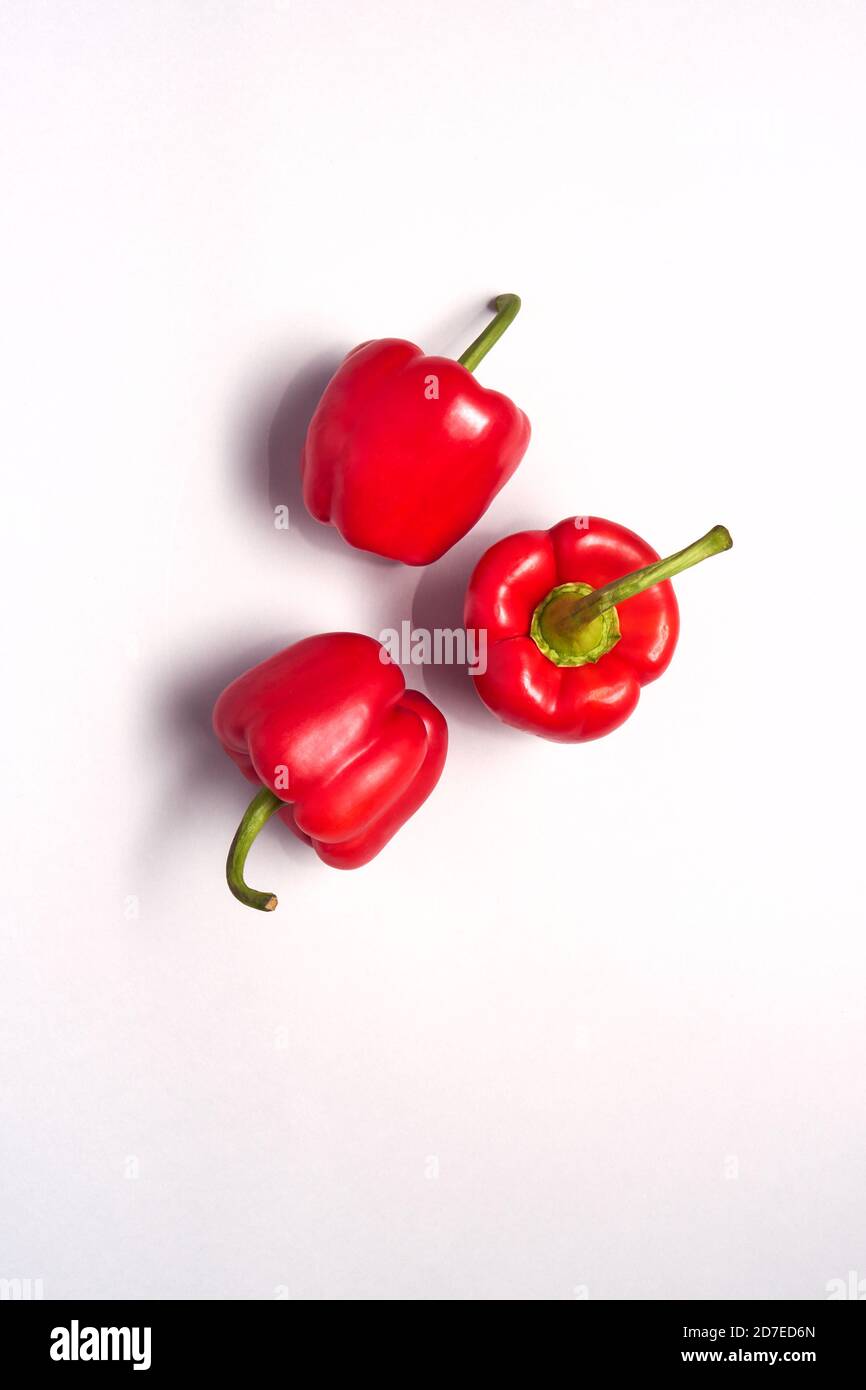 Overhead View Of Red Peppers Against White Background Stock Photo - Alamy