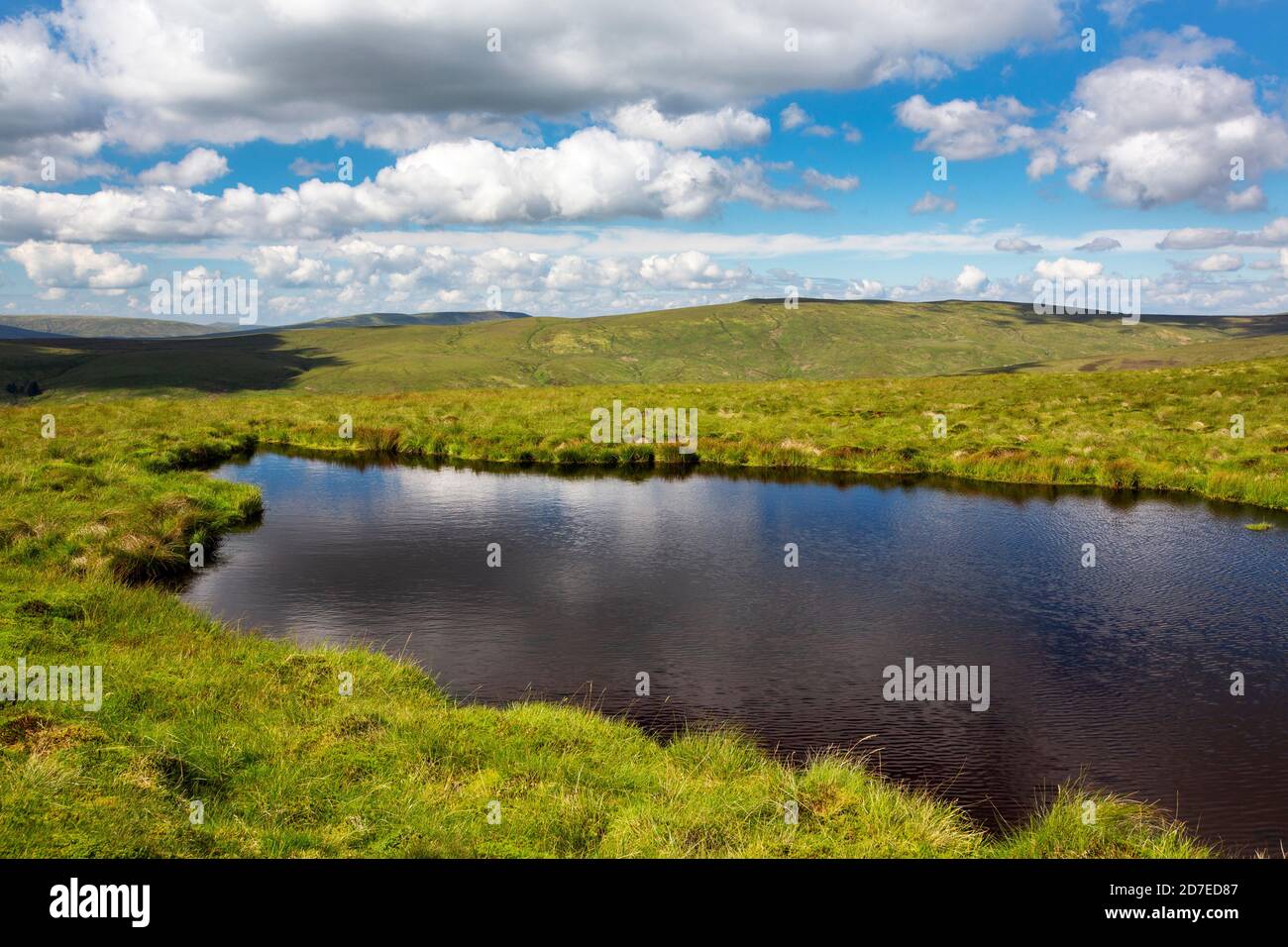 A small peat stained pond on Great Shunner Fell above Hawes, Yorkshire ...