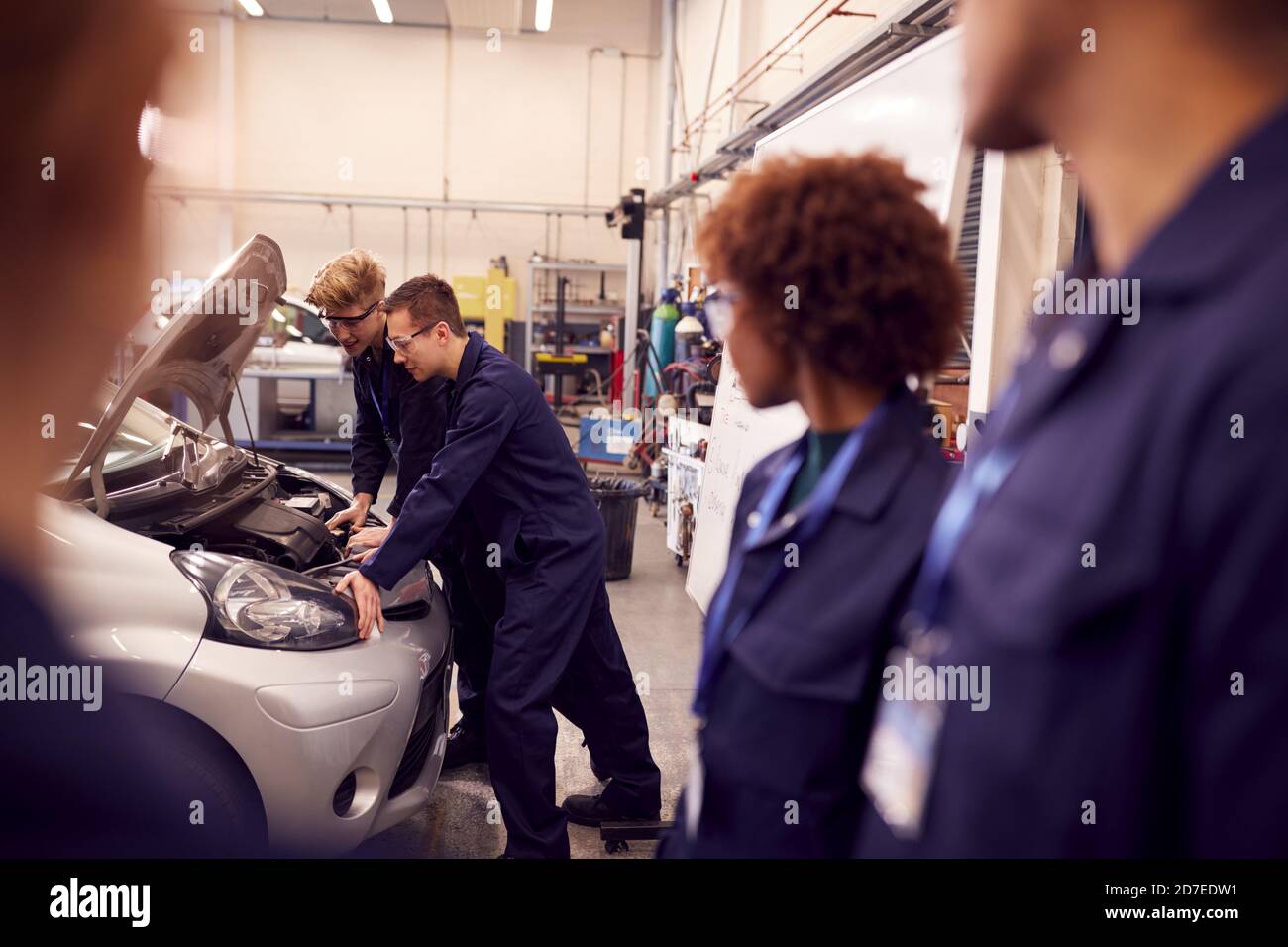 Students Studying For Auto Mechanic Apprenticeship At College Working ...