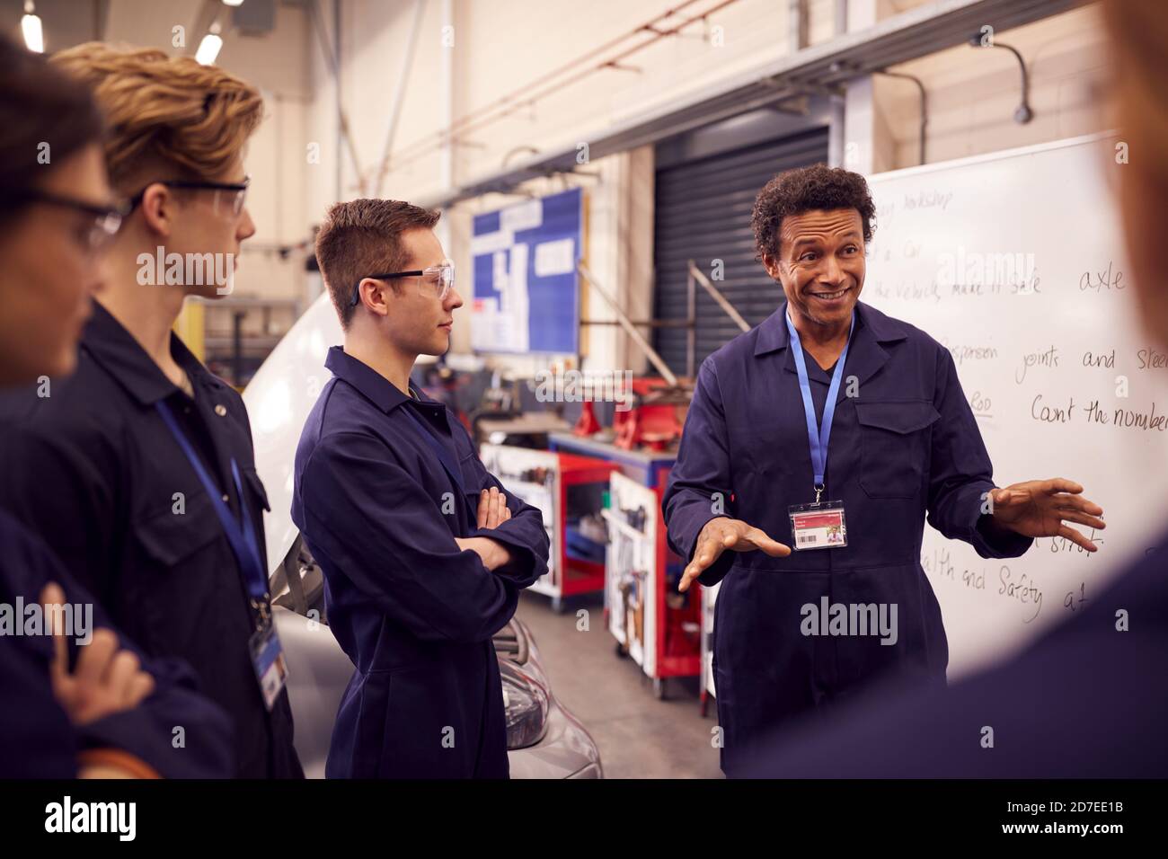 Male Tutor By Whiteboard With Students Teaching Auto Mechanic ...