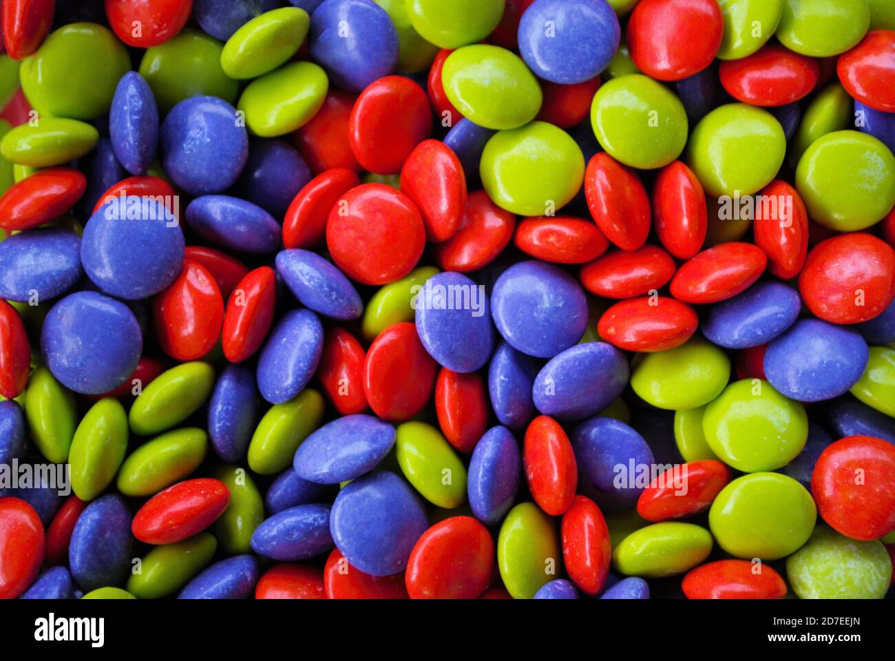 Colorful Halloween candy background orange blue green purple candy ...