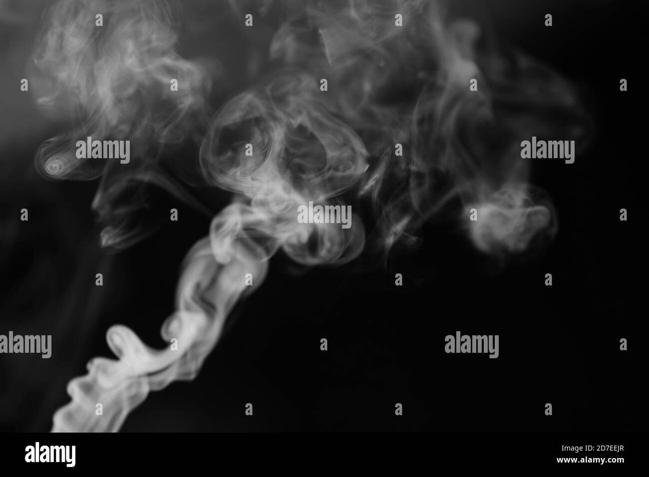 White smoke on a black background. Texture of smoke. Clubs of white ...