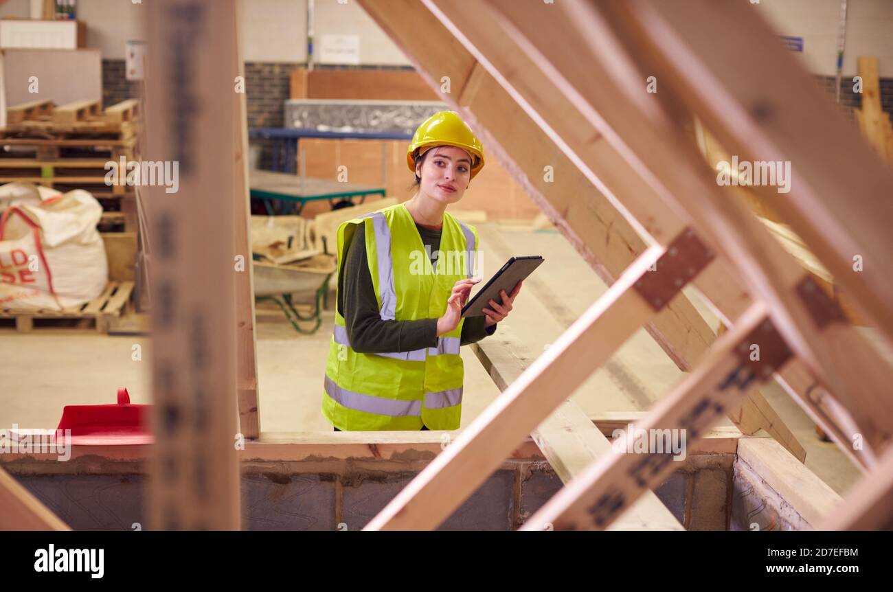 Female Safety Inspector With Digital Tablet At Construction Site Stock ...