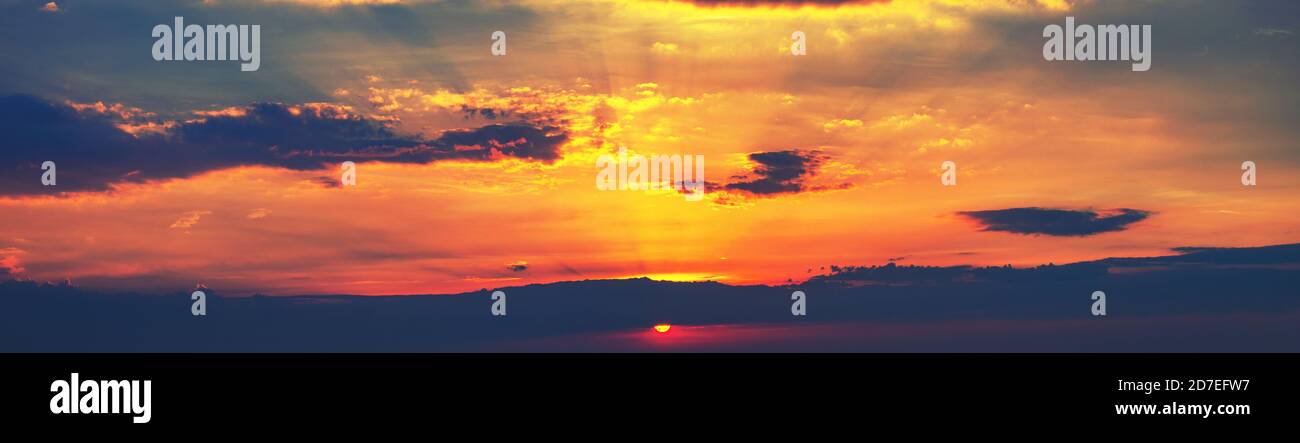 Beautiful colorful sunset sky background with the light of setting sun ...