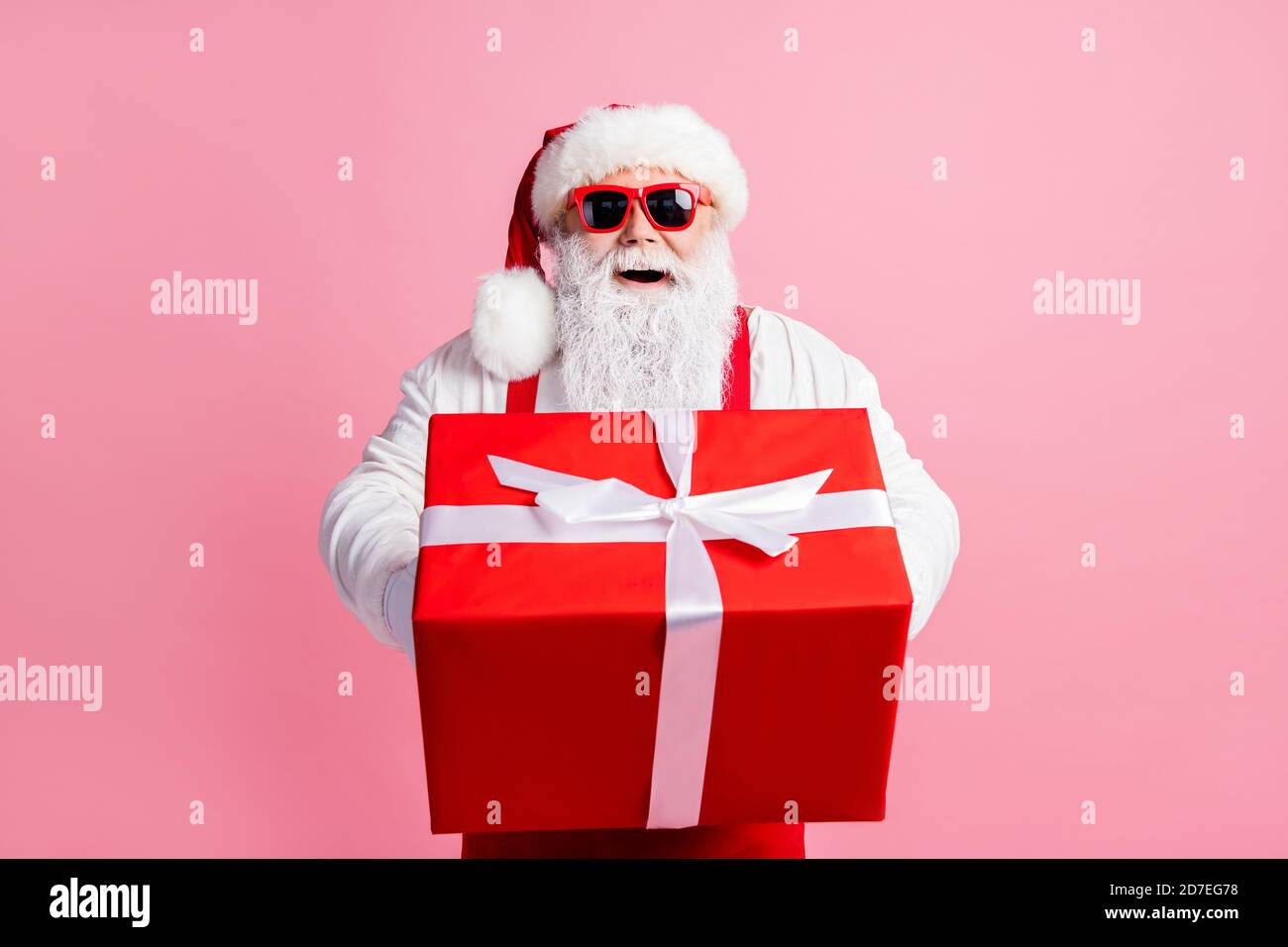 Portrait of his he nice attractive cheerful cheery Santa father holding ...