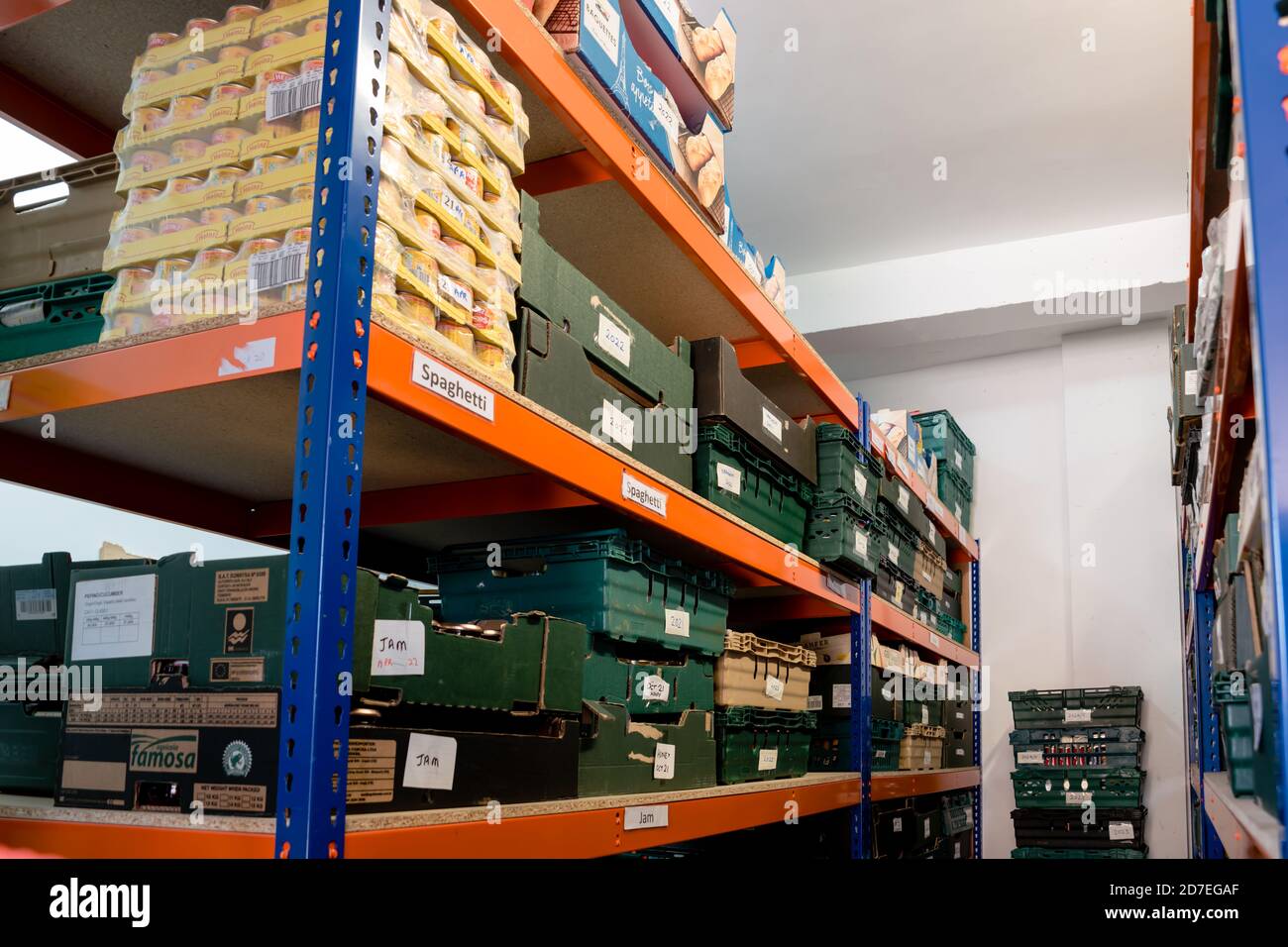Crates and shelves of donated food organised by date in a Trussell ...