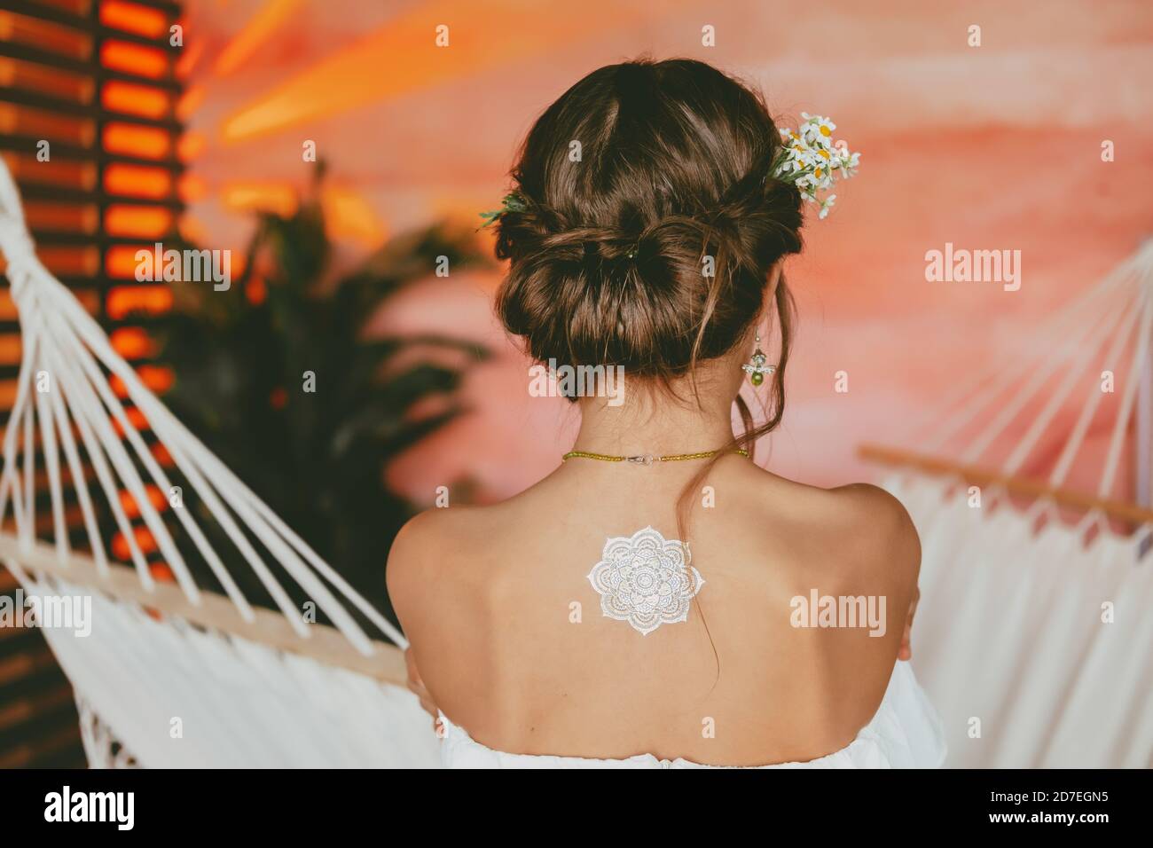temporary back tattoo. beautiful bun and mandala on the back Stock ...