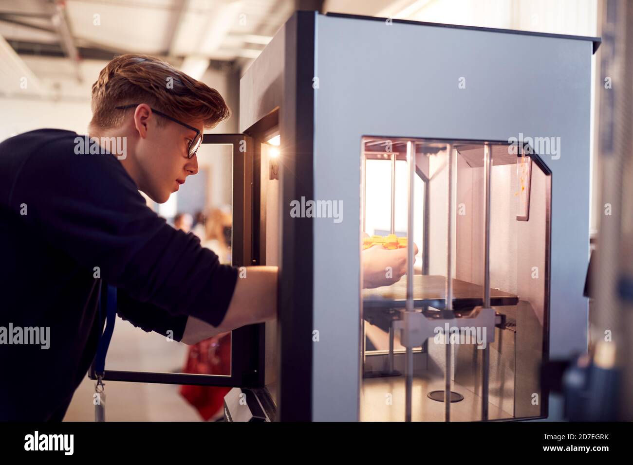 Male College Student Studying Engineering Using 3D Printing Machine ...