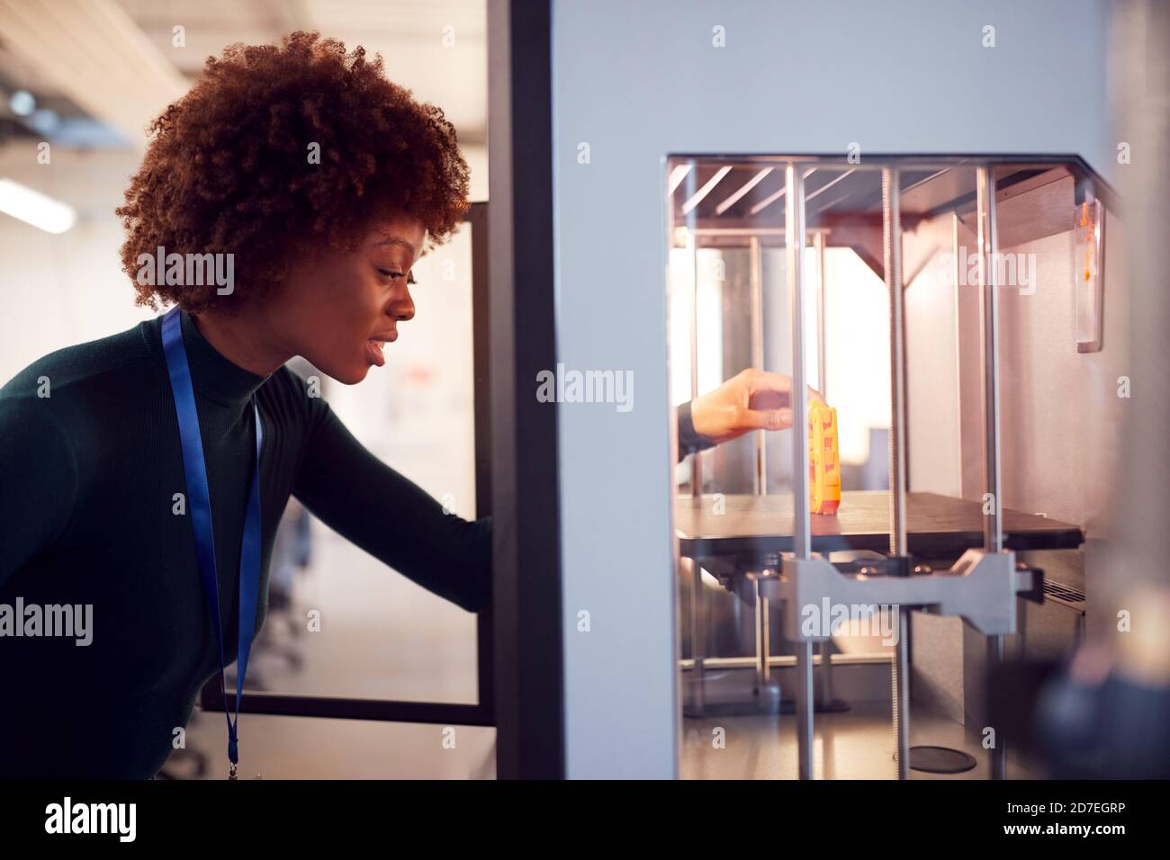 Female College Student Studying Engineering Using 3D Printing Machine ...