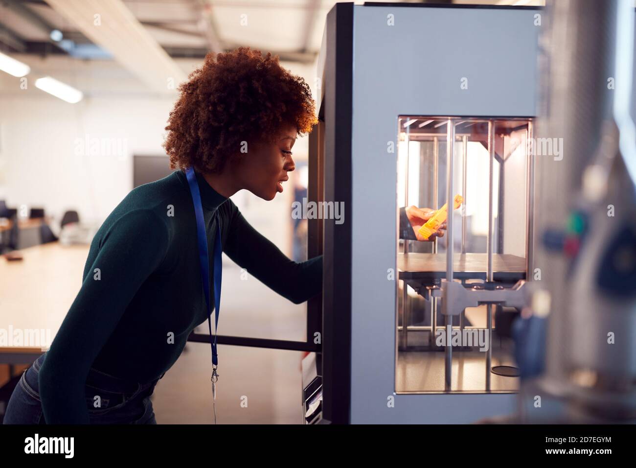Female College Student Studying Engineering Using 3D Printing Machine ...