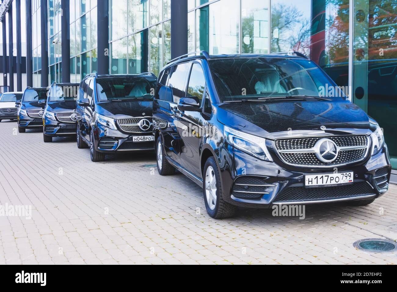 Black luxury van Mercedes-Benz minivan in a row in a parking lot ...