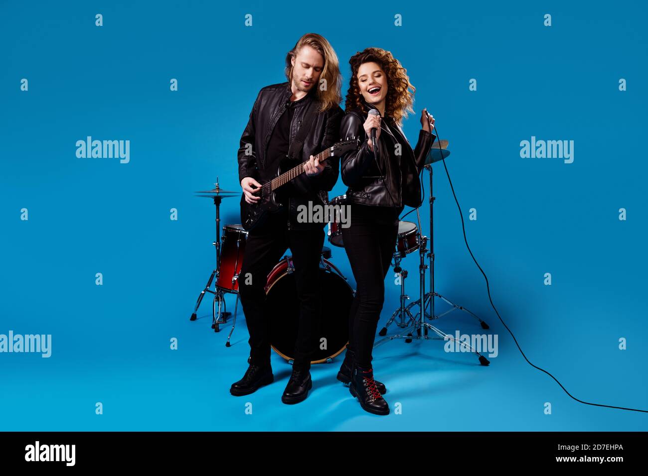 Full length photo of positive famous artist team two people man play ...