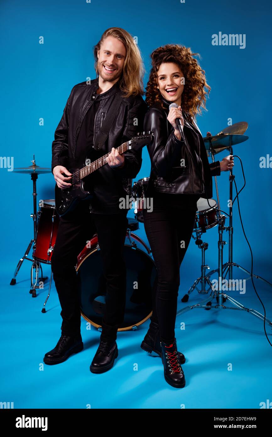 Full length photo positive two people rock band man play bass guitar ...