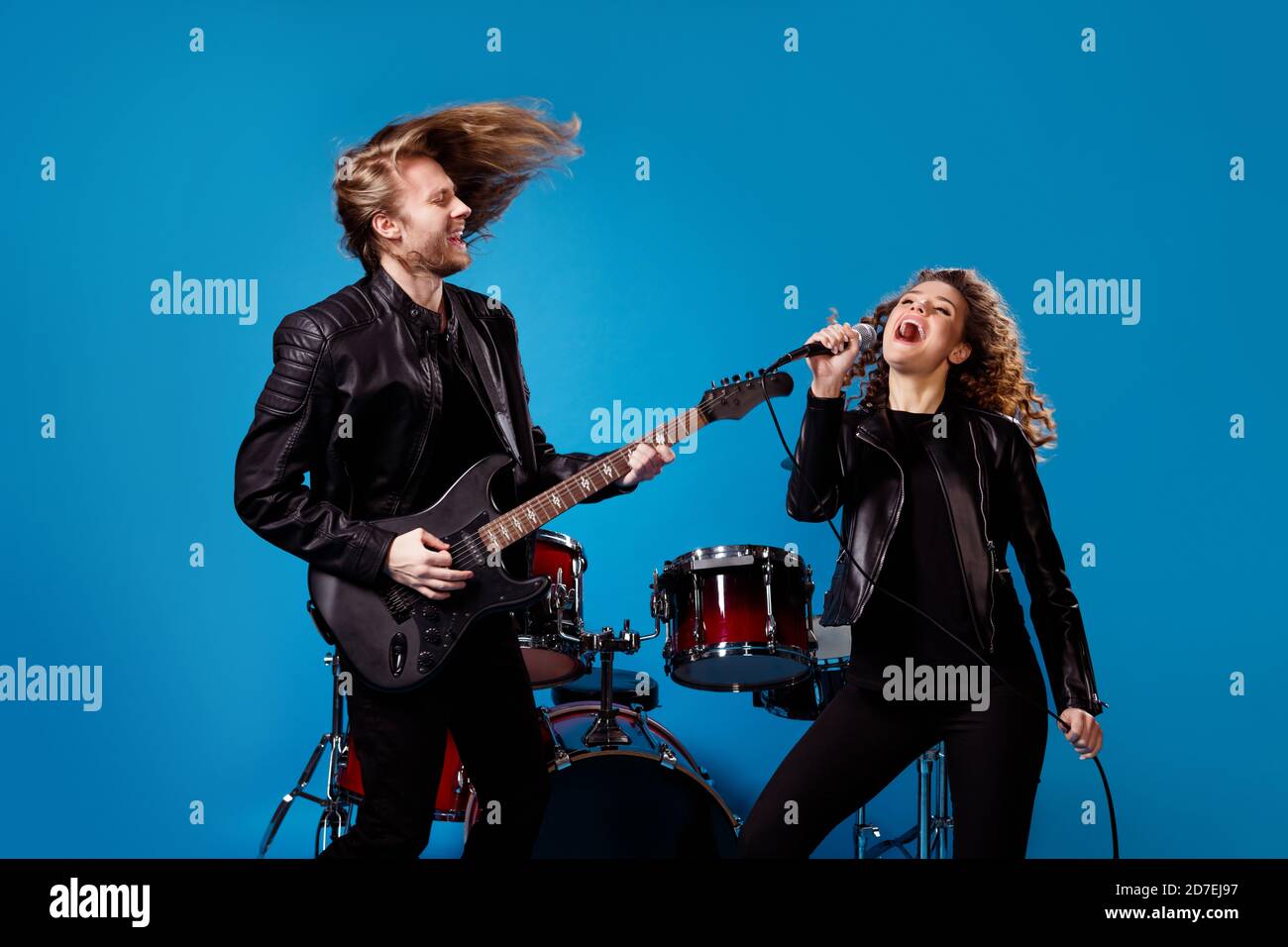 Funky crazy two people rock youth band man play bass guitar girl sing ...