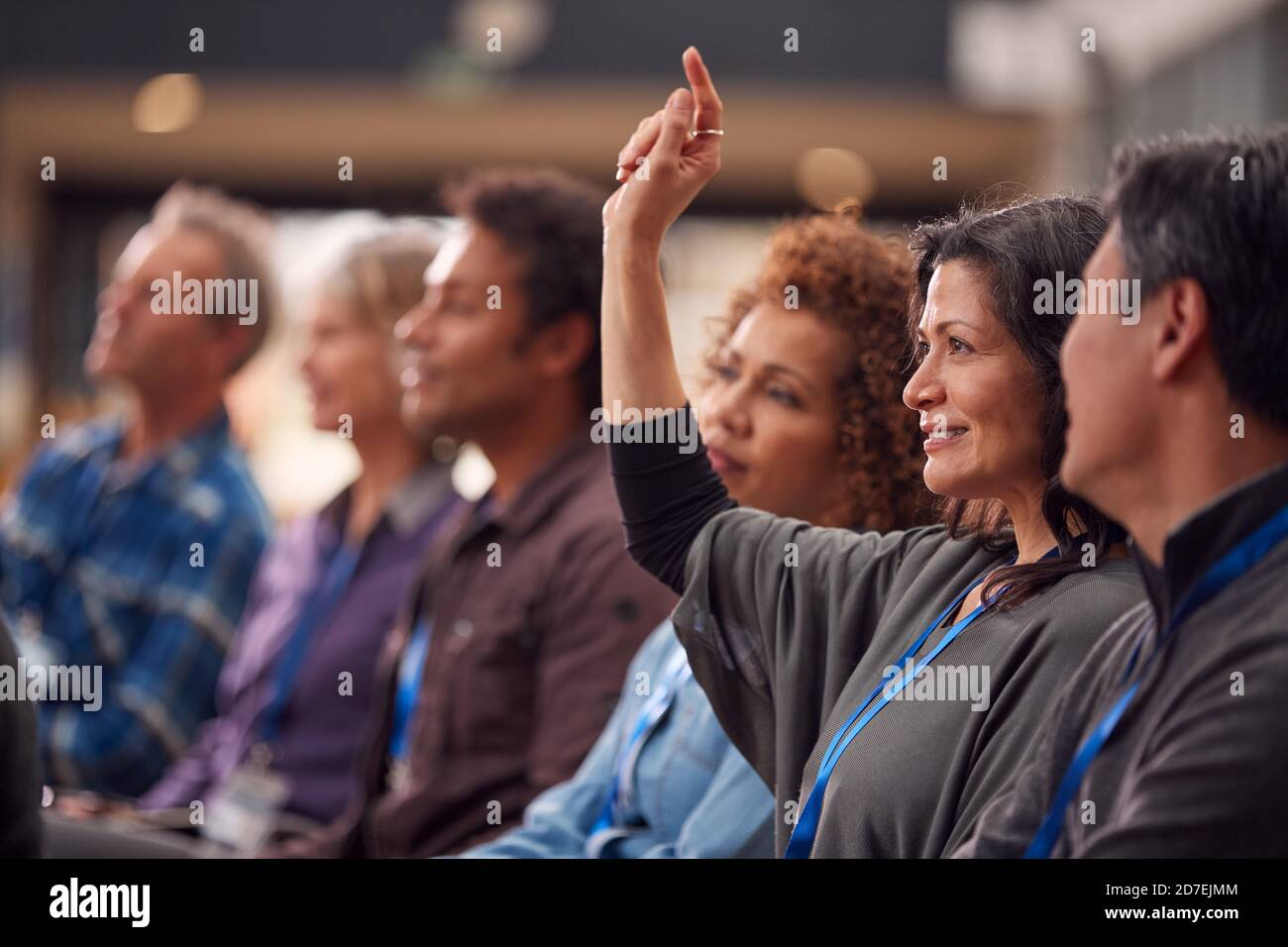 Woman raising hand question hi-res stock photography and images - Alamy