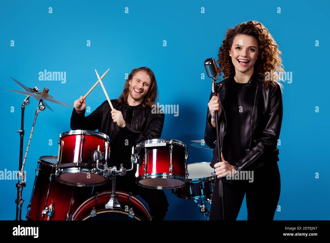 Portrait of man two woman popular artist punk musician play drum ...